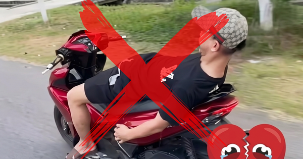Da Nang teenager summoned for riding motorcycle hands-free while lying ...